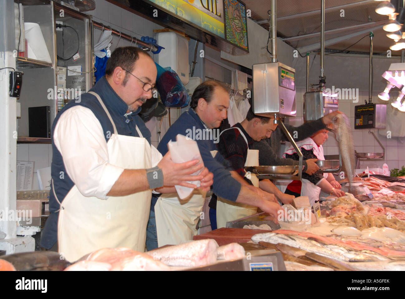 A busy fish stall with a display of locally caught fish inside the food ...