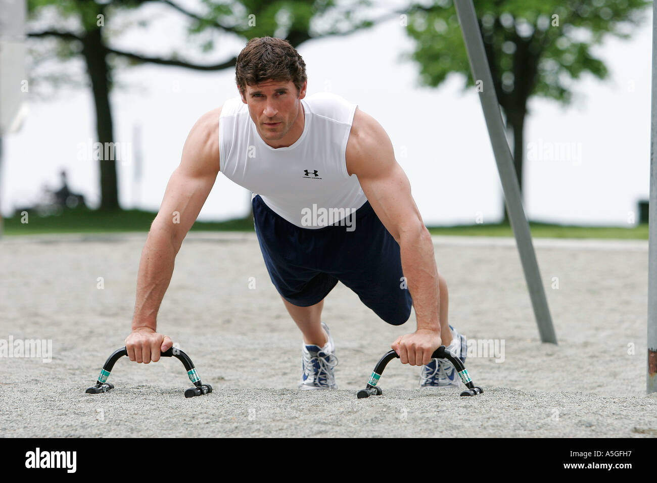 Male body builder arms up hi-res stock photography and images - Alamy
