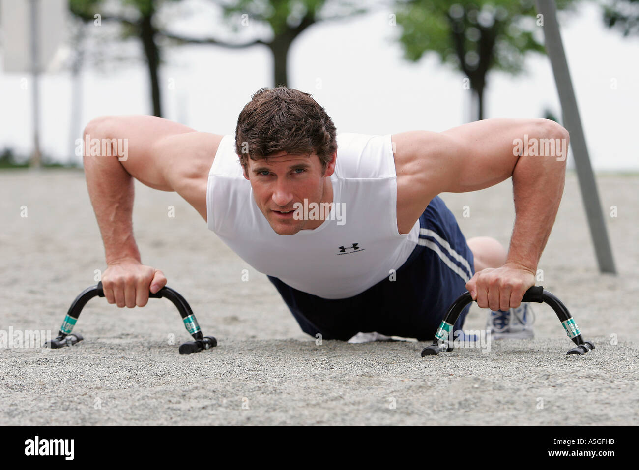 Male body builder arms up hi-res stock photography and images - Alamy