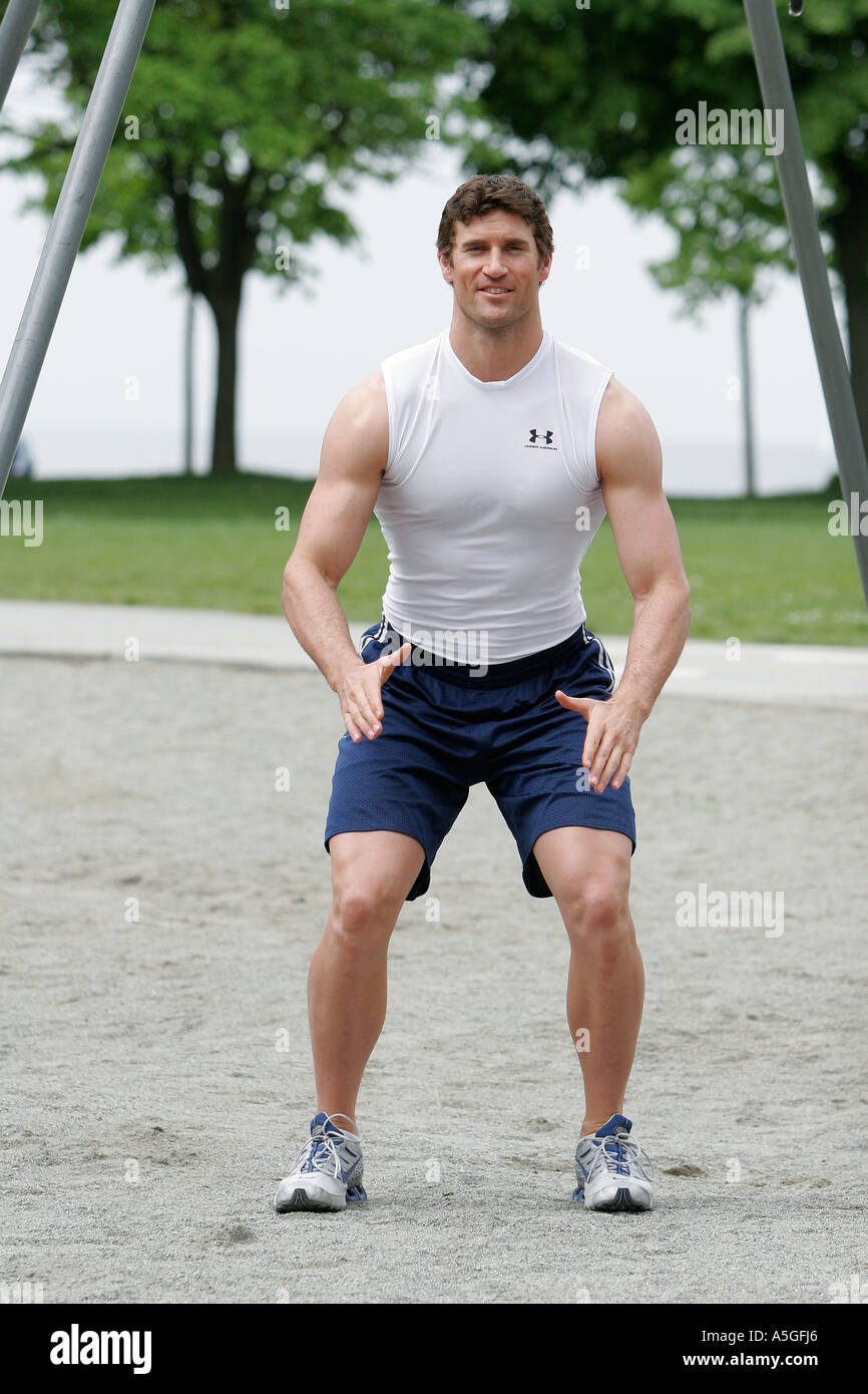 fit male exercising stretching outside Stock Photo - Alamy