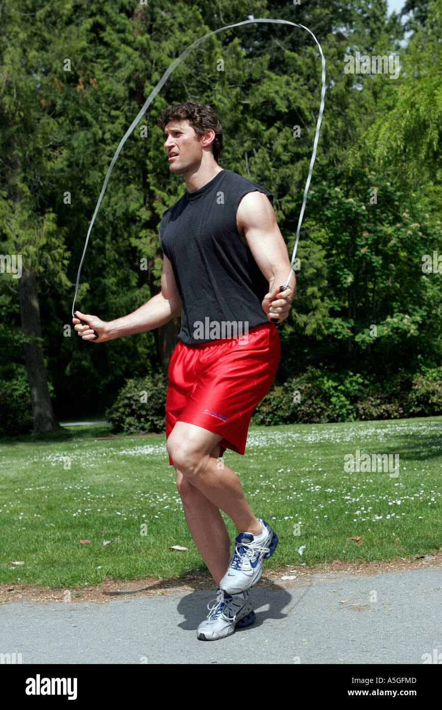 male skipping exercising outside Stock Photo - Alamy