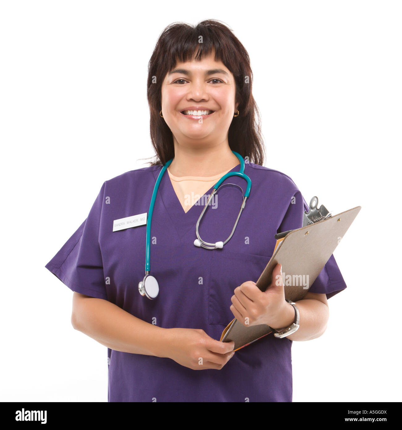 Middle aged Filipino woman dressed in scrubs with stethoscope and ...