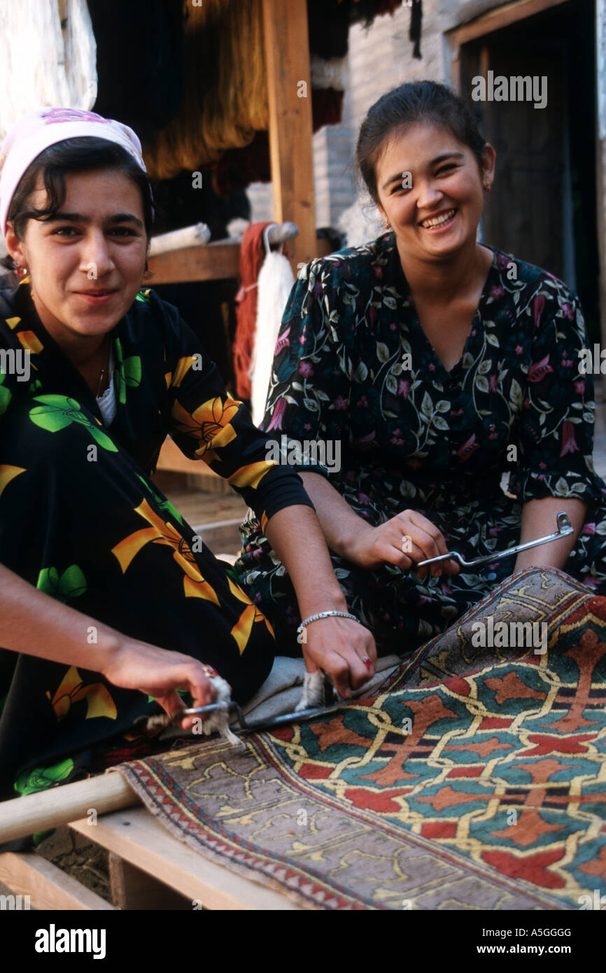 Young women from Chiwa base carpets, Uzbekistan, Chiwa Stock Photo - Alamy