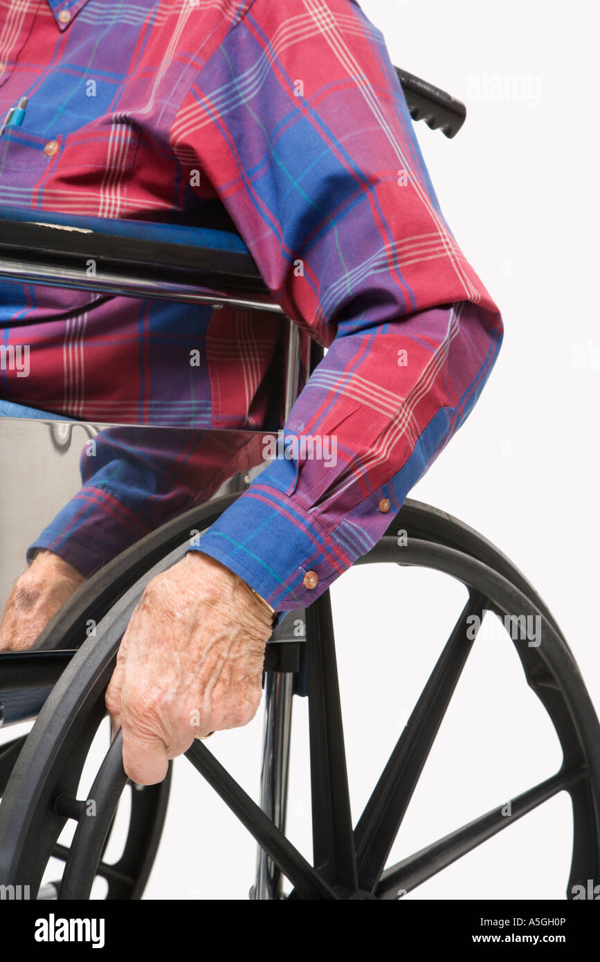 Caucasion male elderly hands gripping wheels of wheelchair Stock Photo ...