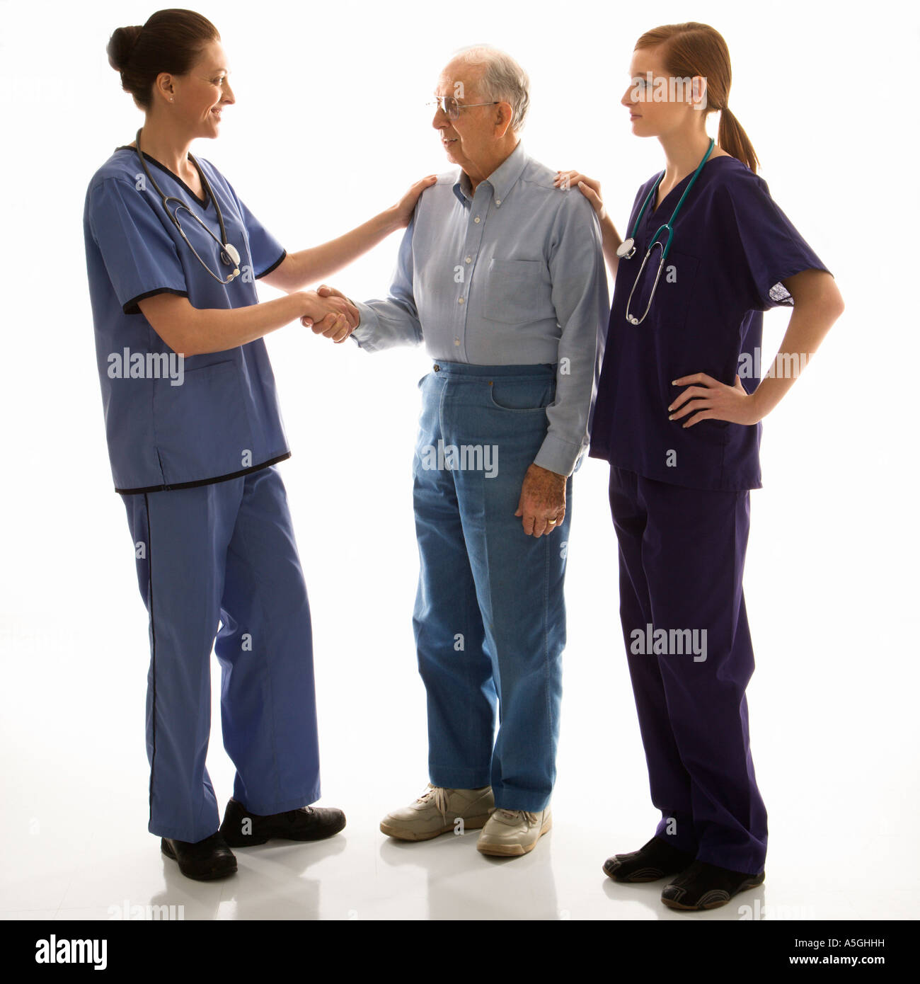 Healthcare worker shaking patient's hand Stock Photo - Alamy