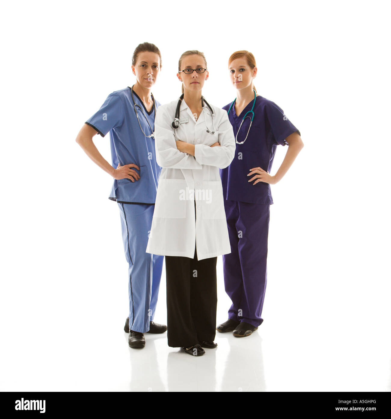 Full length portrait of Caucasian women healthcare workers in uniforms ...