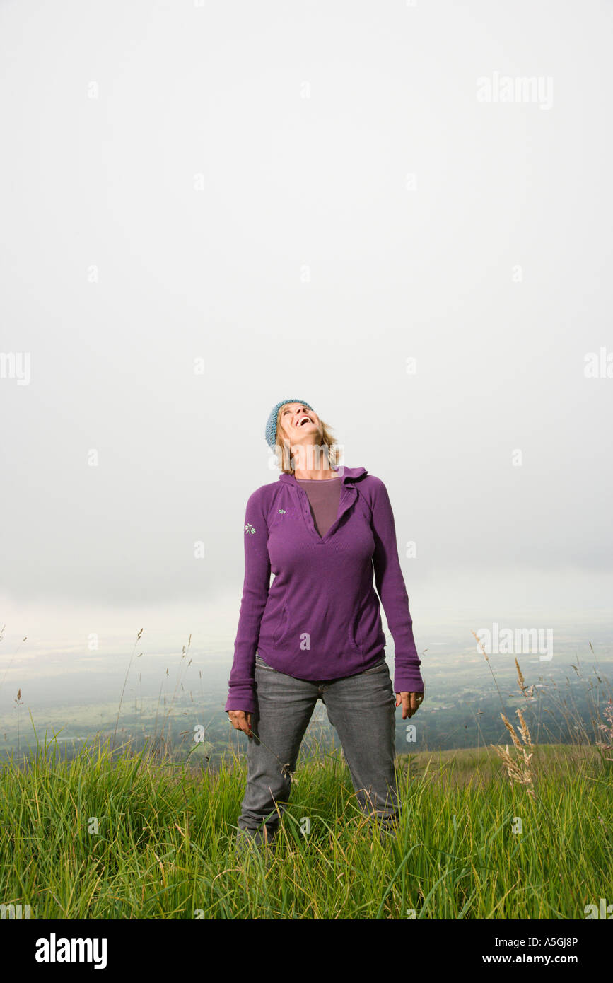 Woman Standing Alone In Field