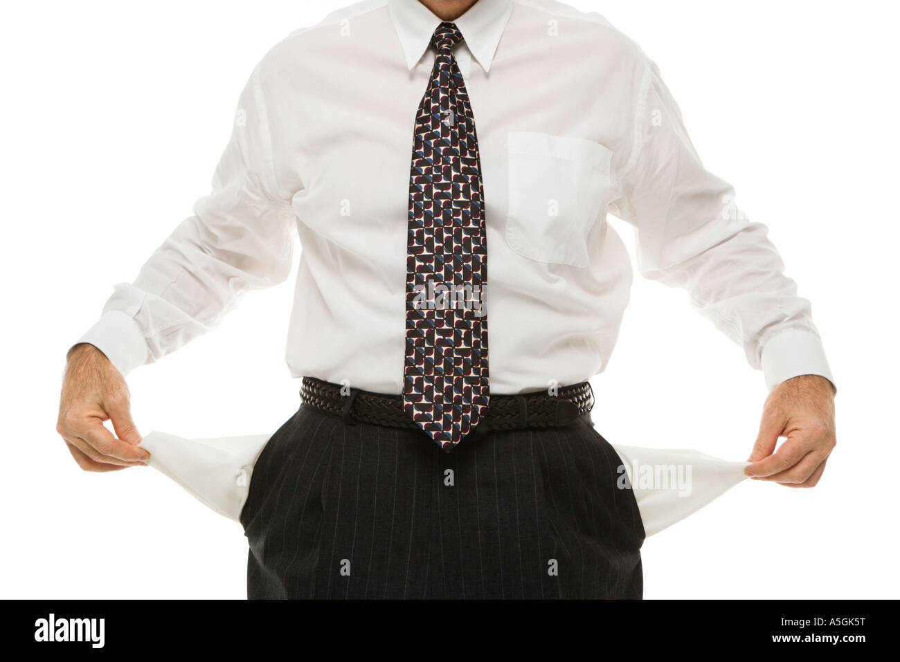 Caucasian middle aged businessman pulling empty pockets out standing ...