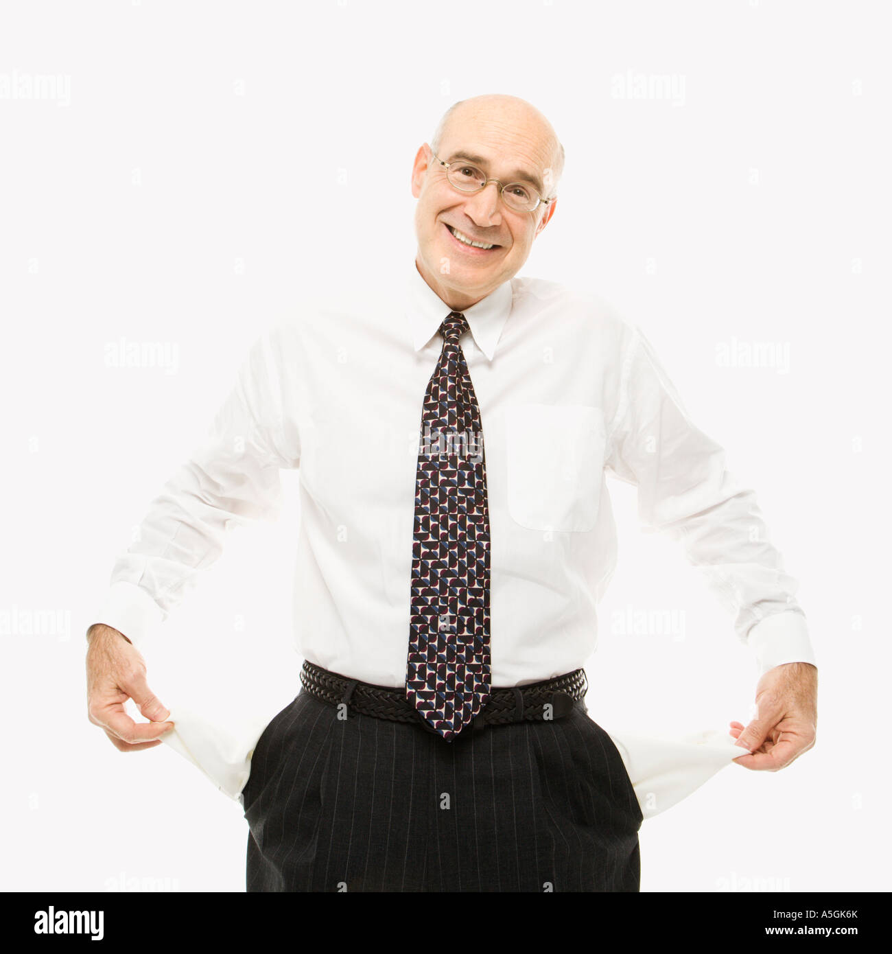 Caucasian middle aged businessman pulling empty pockets out standing ...