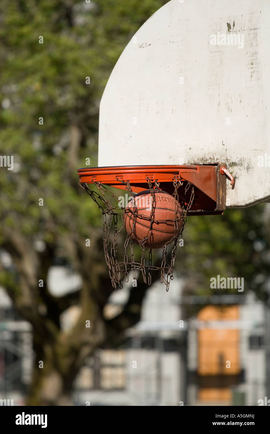 Basketball in hoop Stock Photo - Alamy