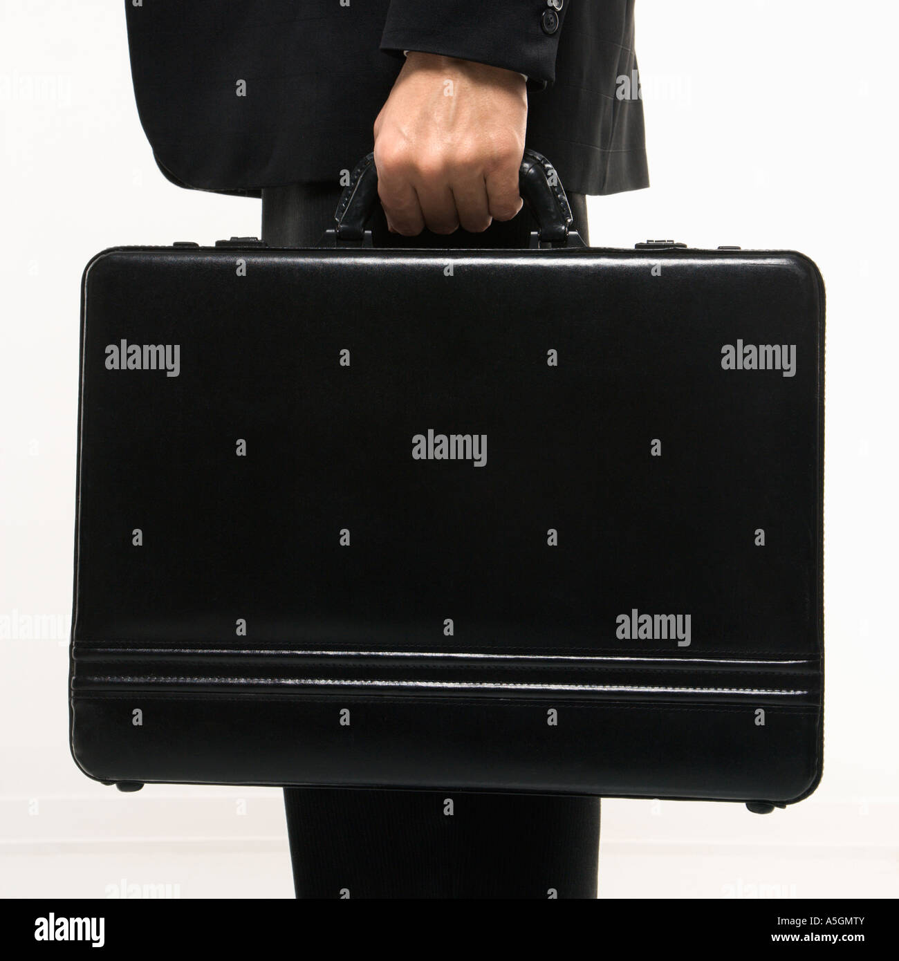 Caucasian mid adult man s hand holding briefcase Stock Photo - Alamy