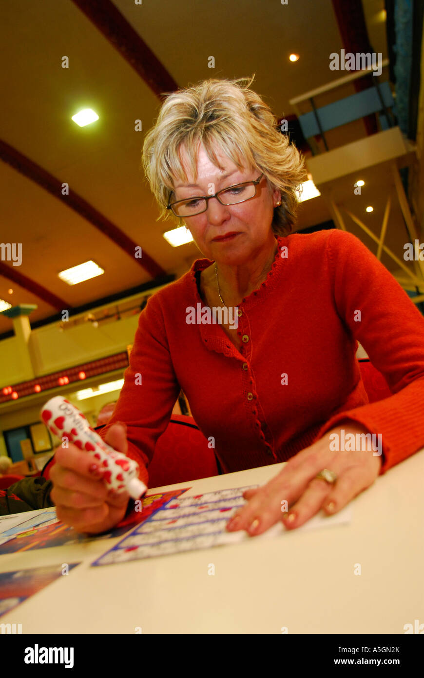 Elderly woman playing bingo in Fulham, west London, UK Stock Photo - Alamy