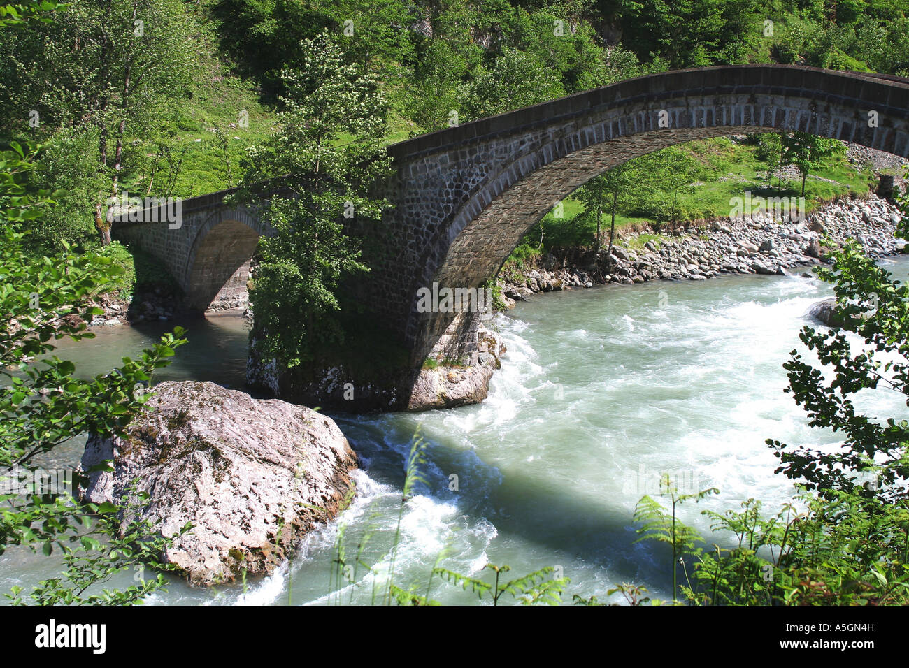 old arch bridge over mountain creek in the Pontical Mountains, Turkey ...