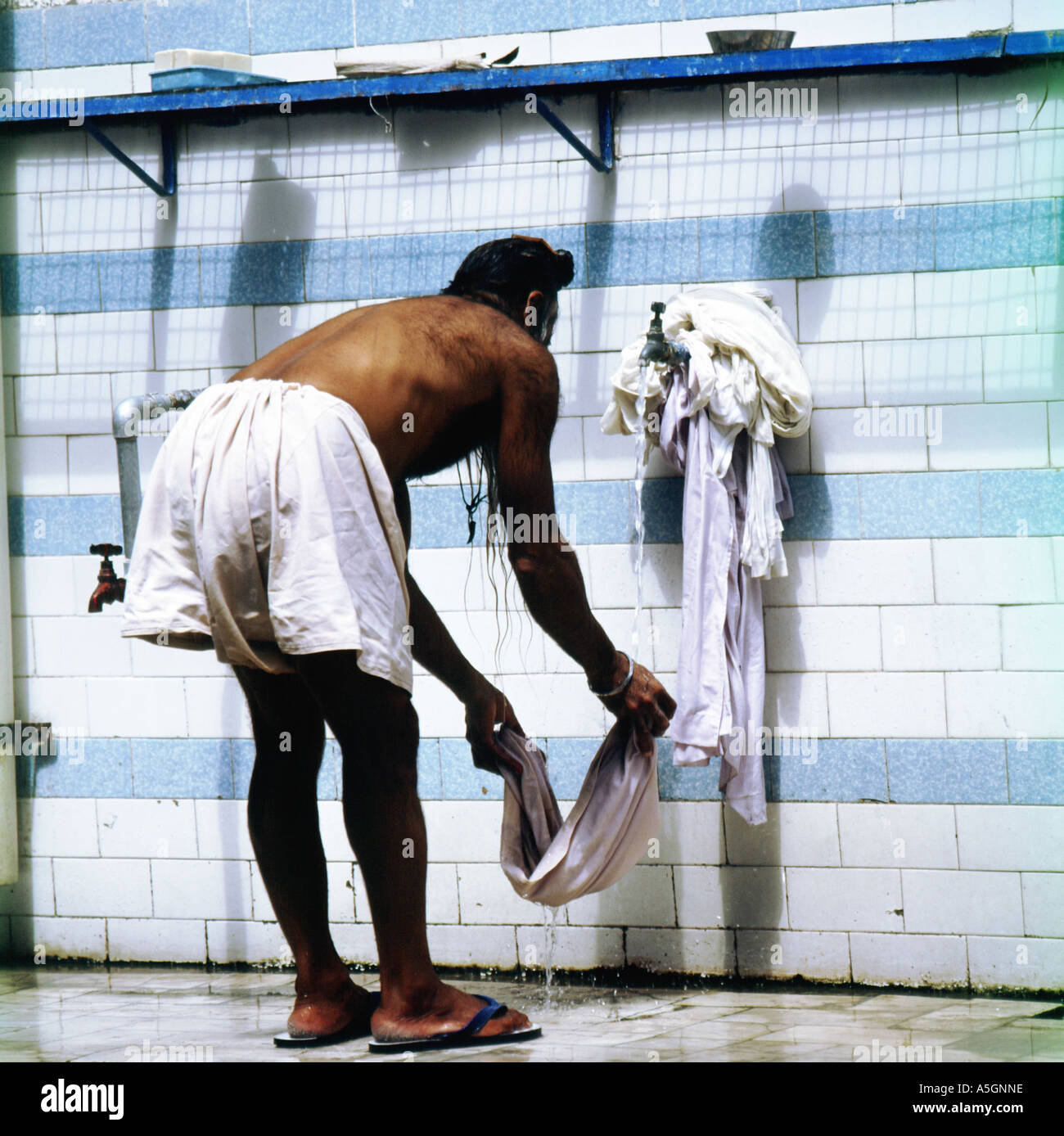 Man washing clothes Stock Photo - Alamy
