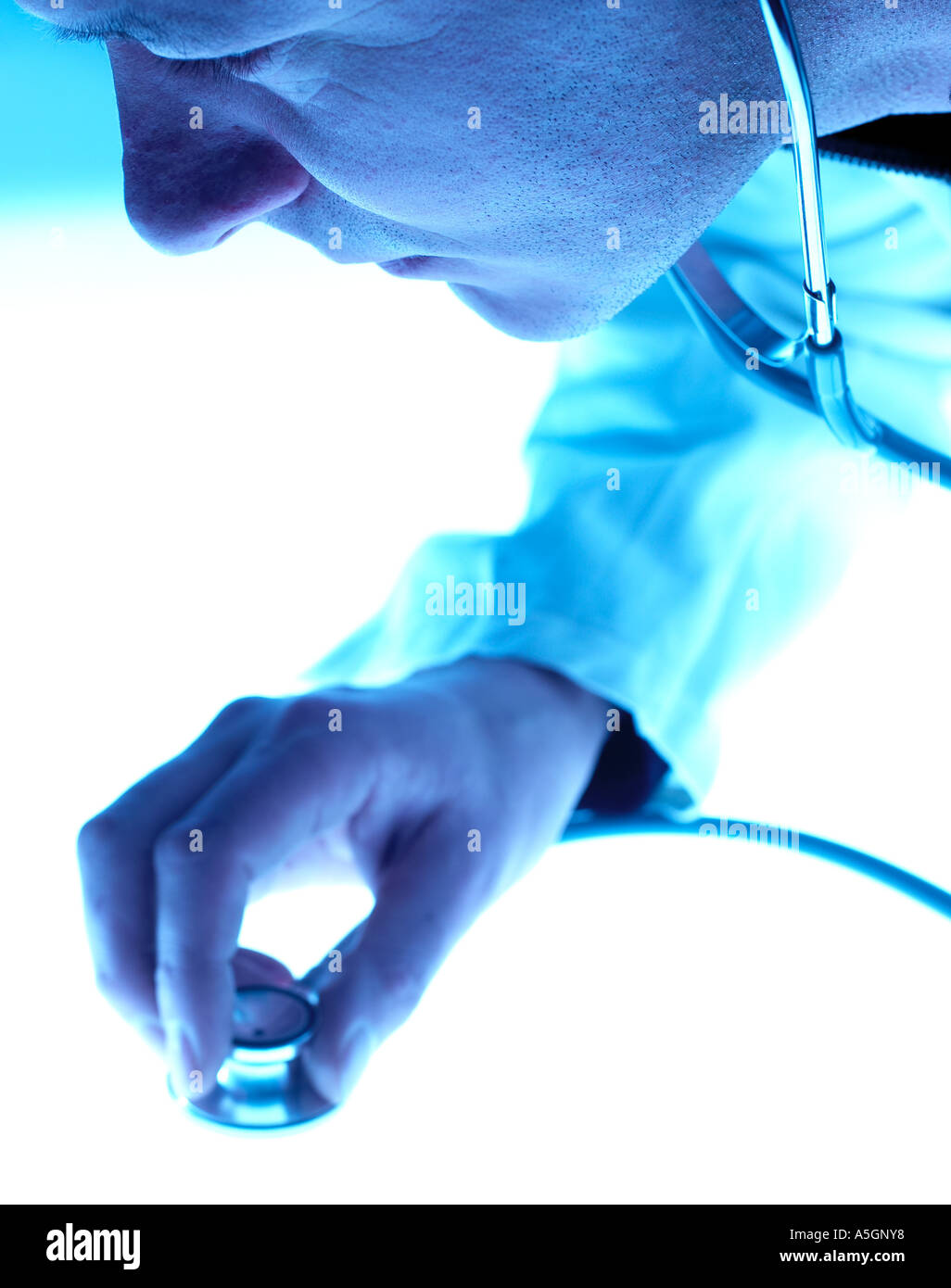 Doctor using stethoscope Stock Photo - Alamy
