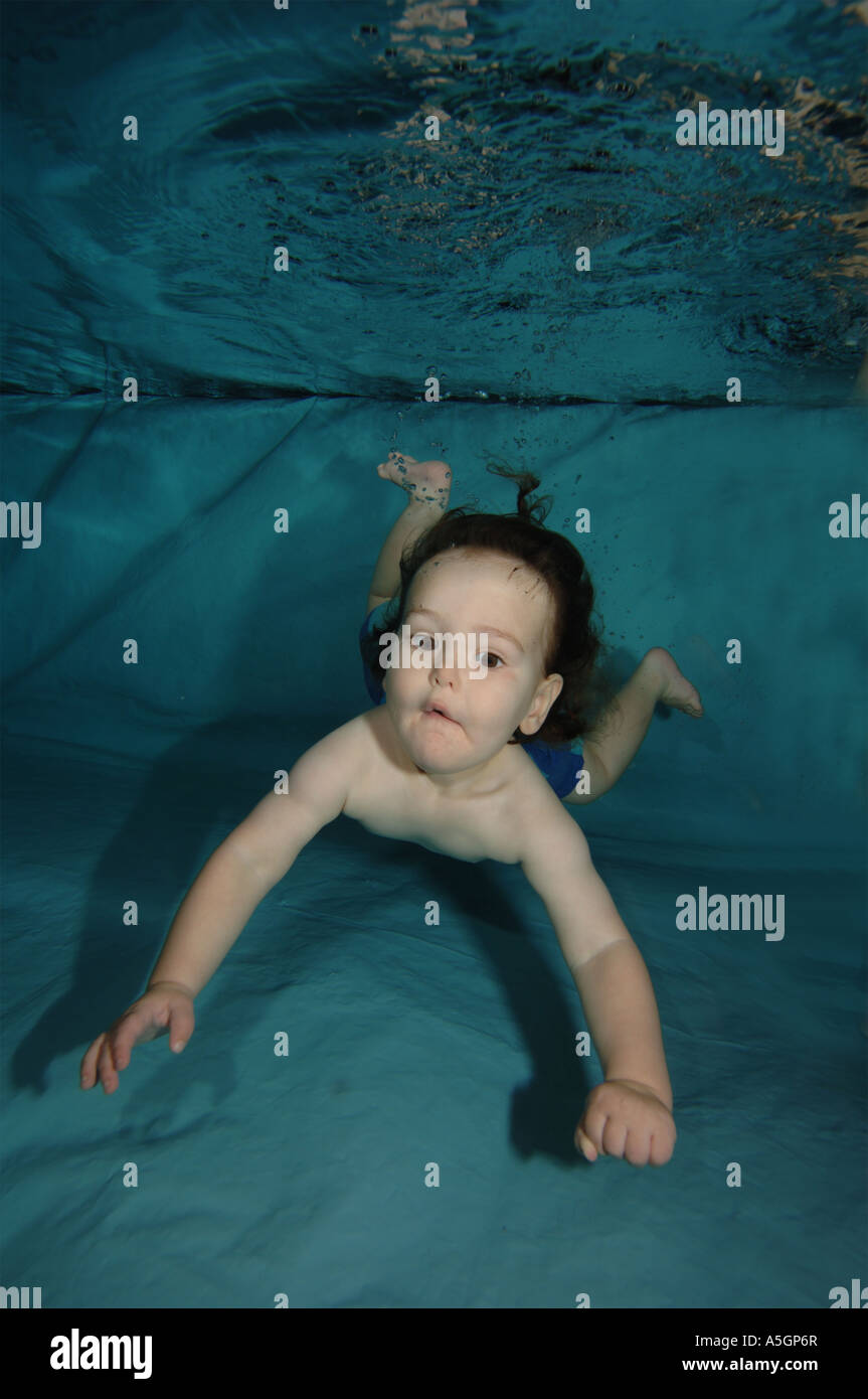 infant learning to swim in waterbaby class Stock Photo - Alamy
