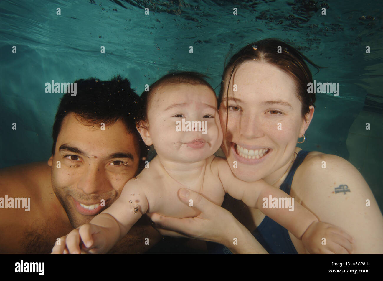 infant learning to swim in waterbaby class Stock Photo - Alamy