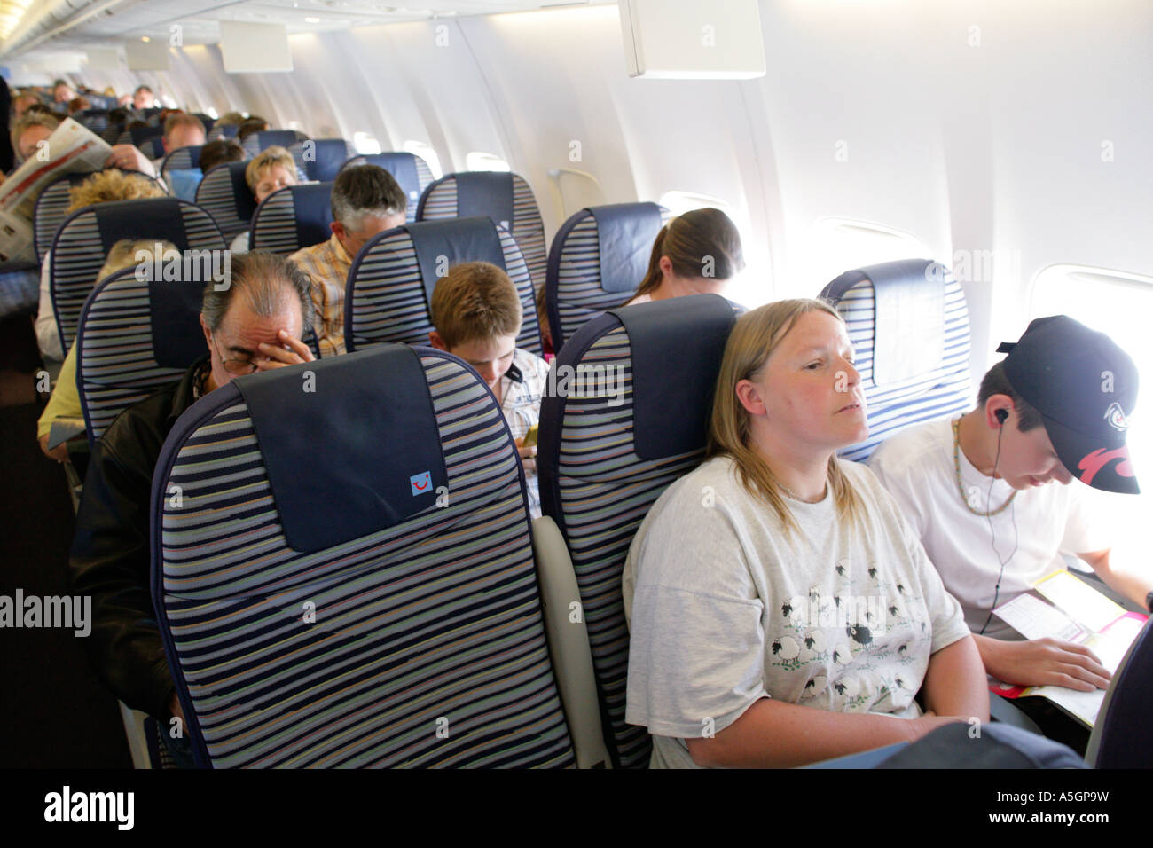 inside a passenger plane at flight Stock Photo - Alamy