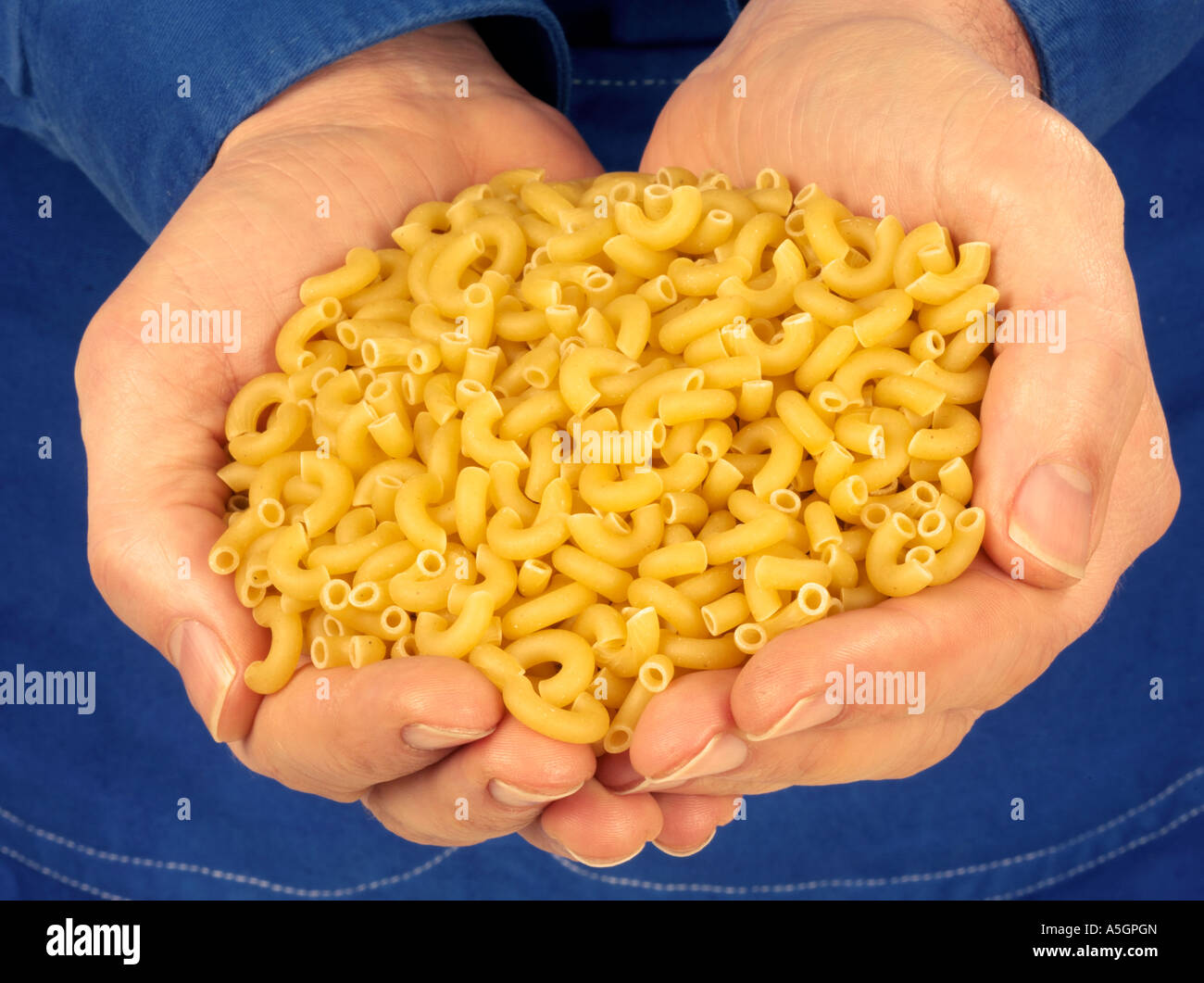 MAN HOLDING MACARONI PASTA Stock Photo - Alamy