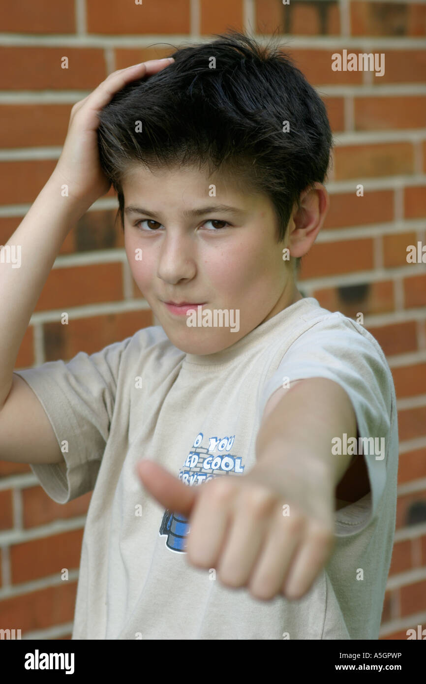 portrait of a cool young boy with his thumb up Stock Photo - Alamy