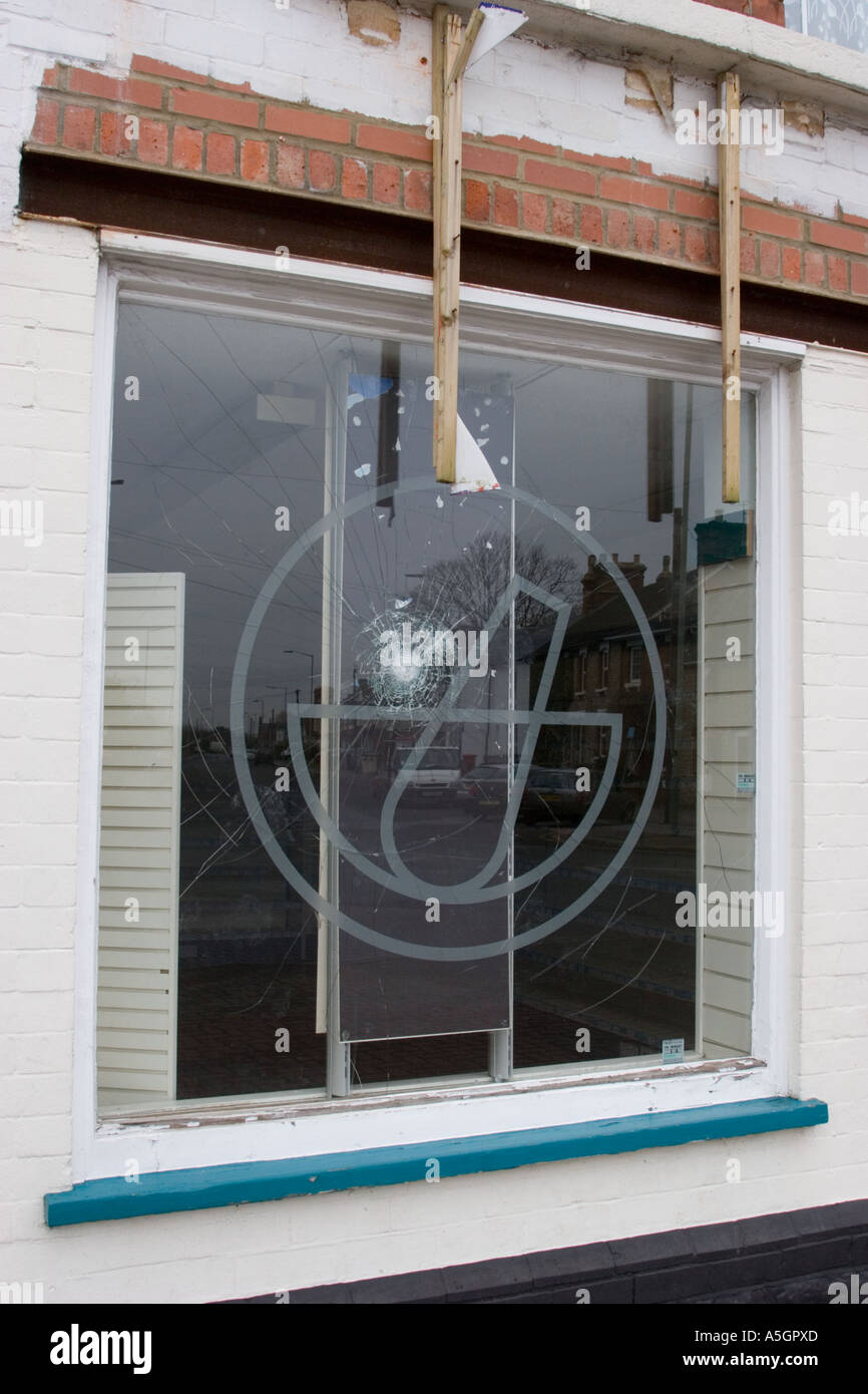 Broken window of pharmacist shop Stock Photo - Alamy