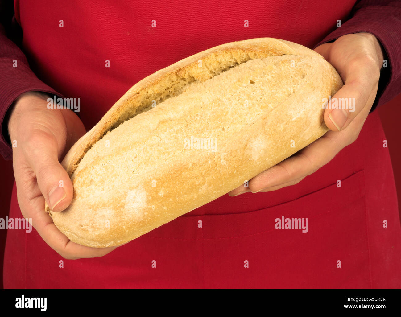 MAN HOLDING SOURDOUGH BREAD Stock Photo - Alamy