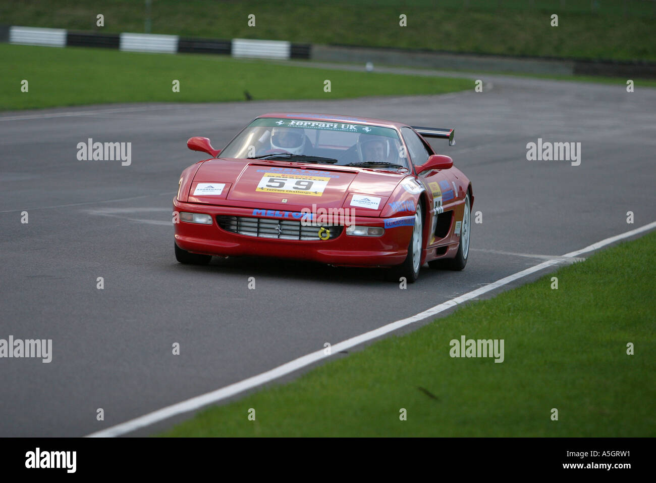 Ferrari sports car performing on the race track Stock Photo - Alamy