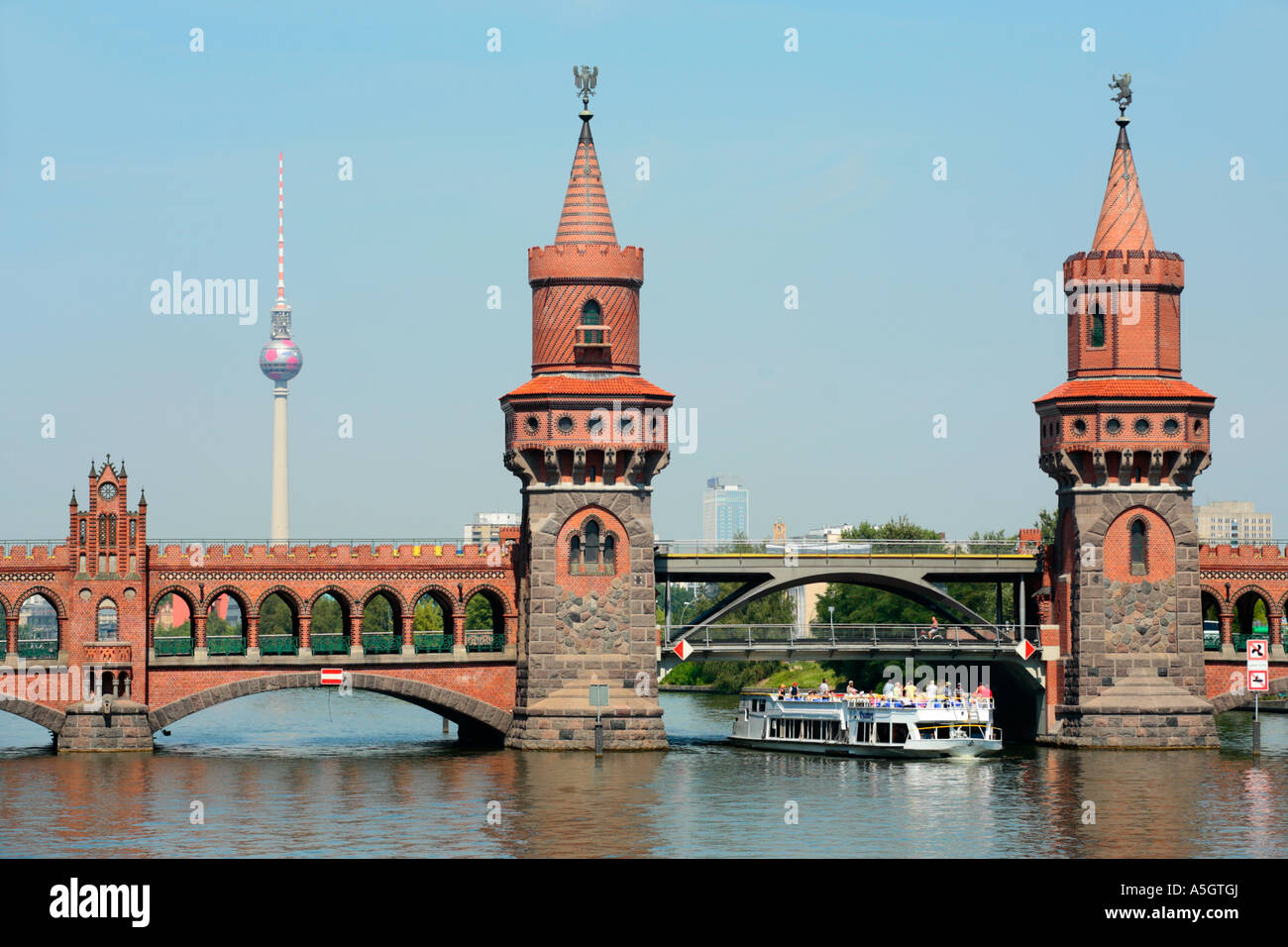 Oberbaum Bridge across the river Spree in Berlin with the television ...