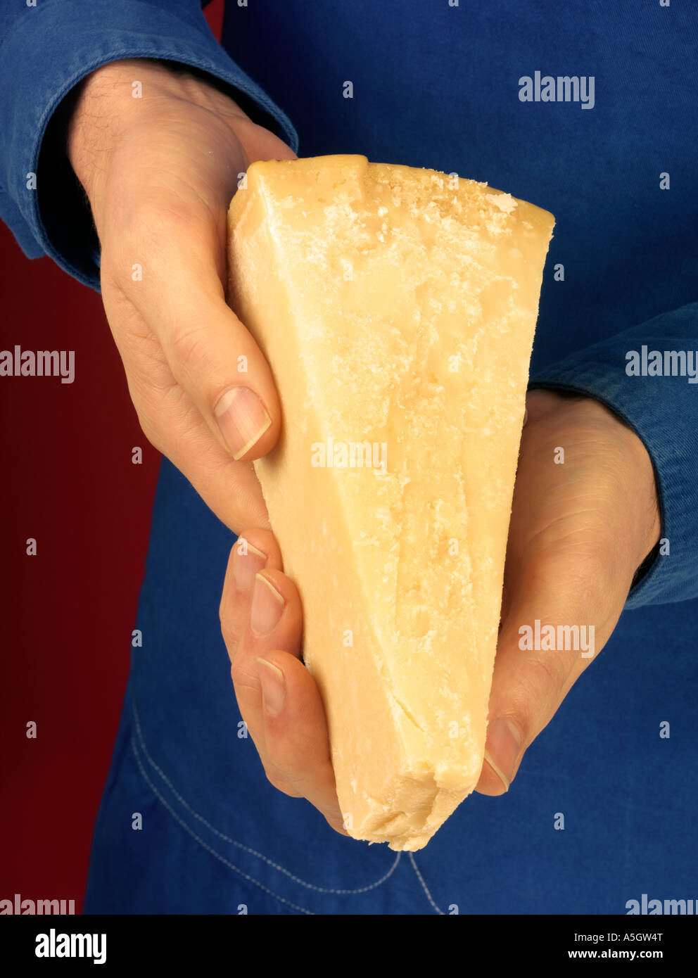 MAN HOLDING PARMESAN CHEESE Stock Photo - Alamy