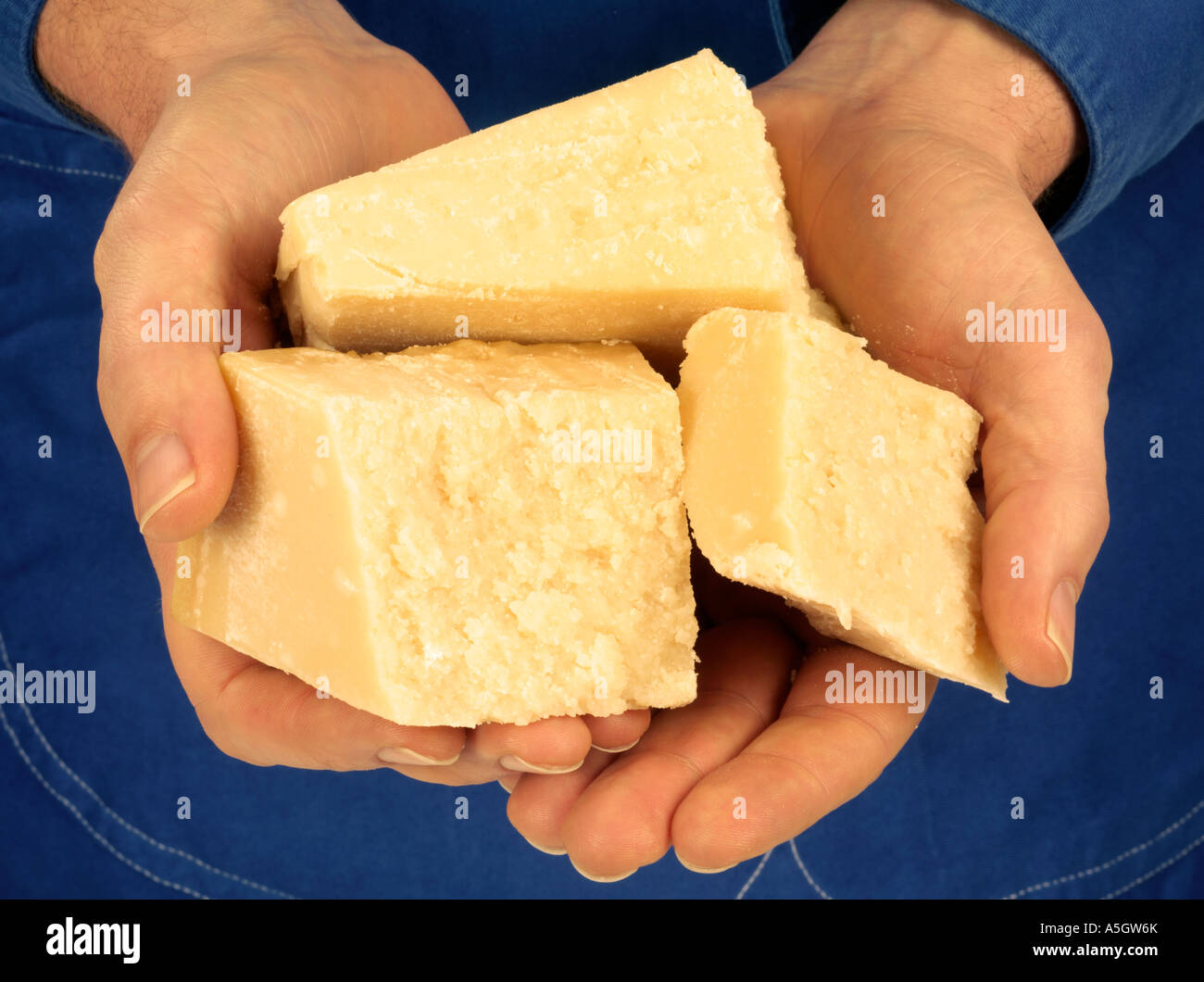 MAN HOLDING PARMESAN CHEESE Stock Photo - Alamy