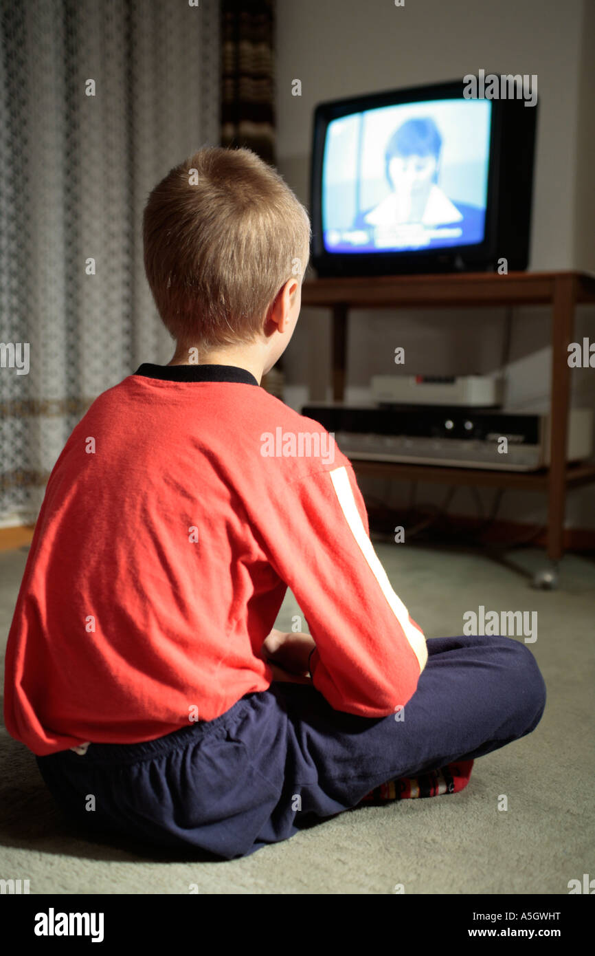 portrait of a young boy watching television Stock Photo - Alamy