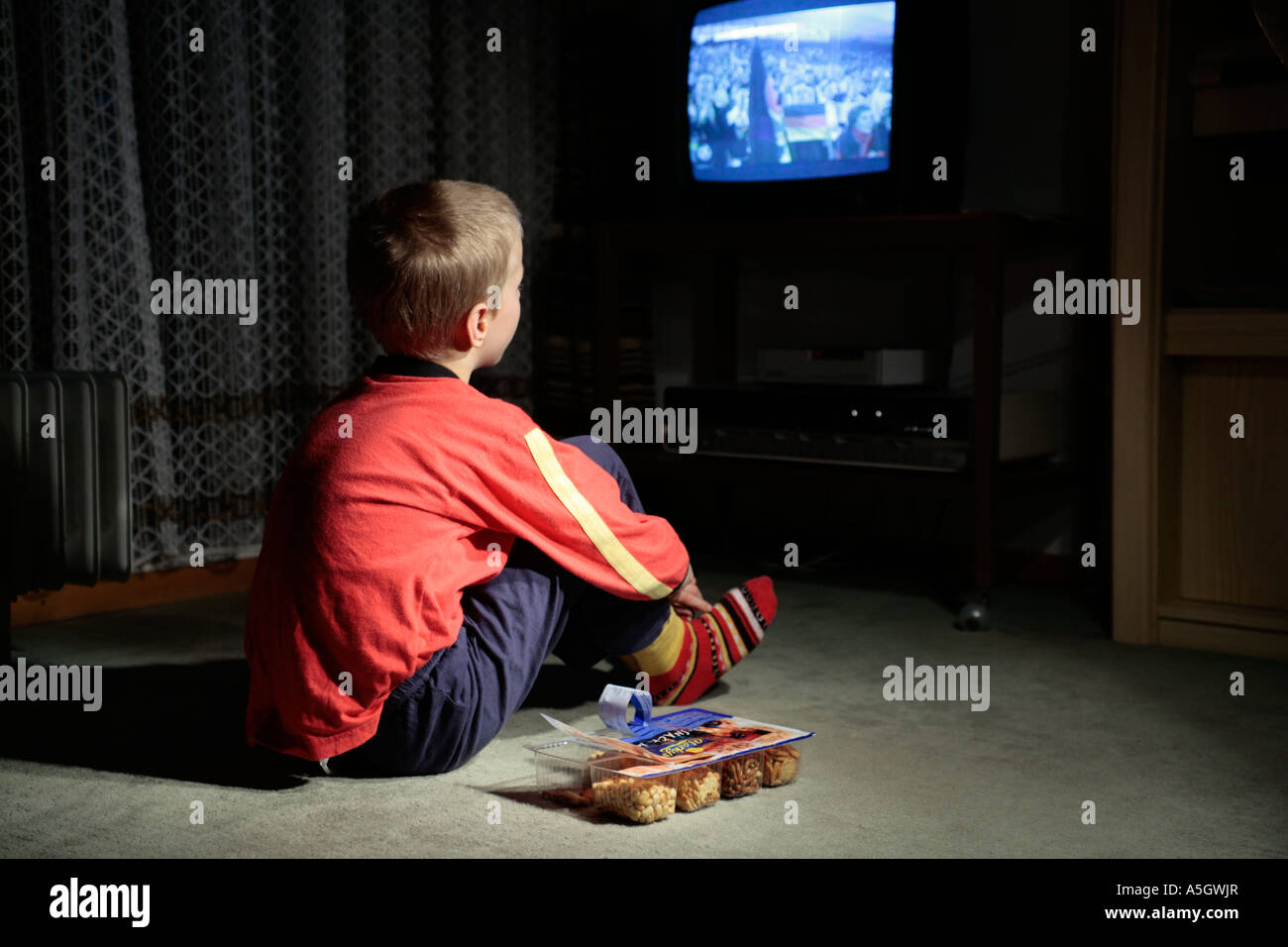 portrait of a young boy watching television Stock Photo - Alamy
