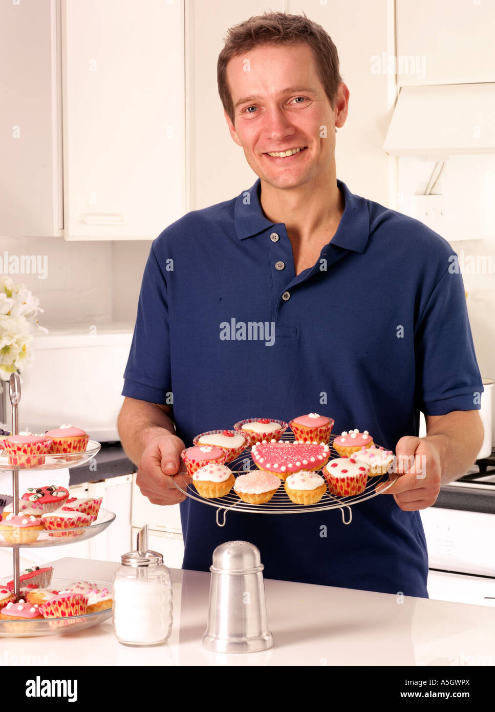 MAN IN KITCHEN WITH CAKES Stock Photo - Alamy