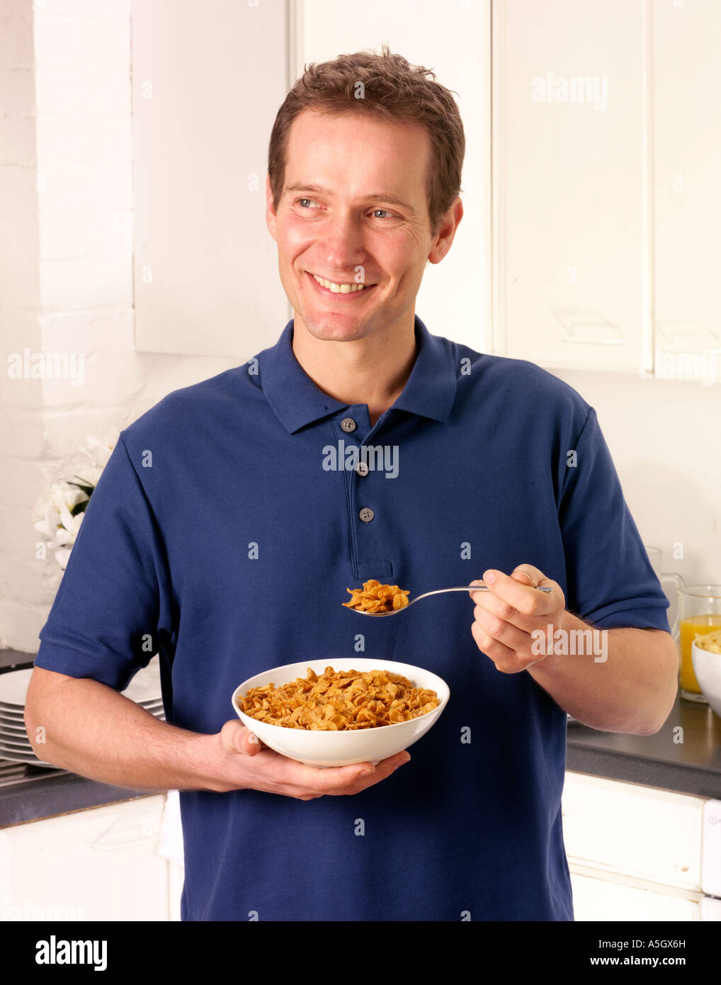 Man eating corn flakes hi-res stock photography and images - Alamy