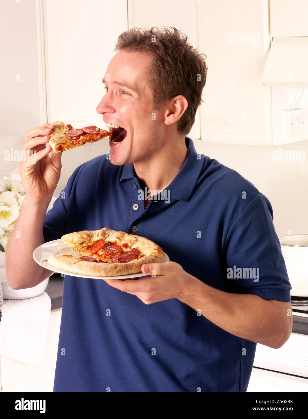 Adult overeating meal alone hi-res stock photography and images - Alamy