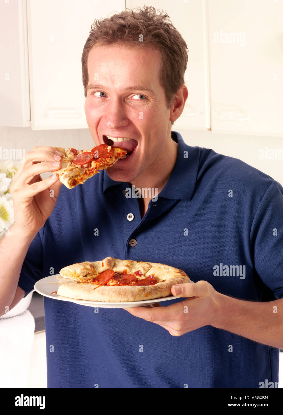 Adult overeating meal alone hi-res stock photography and images - Alamy