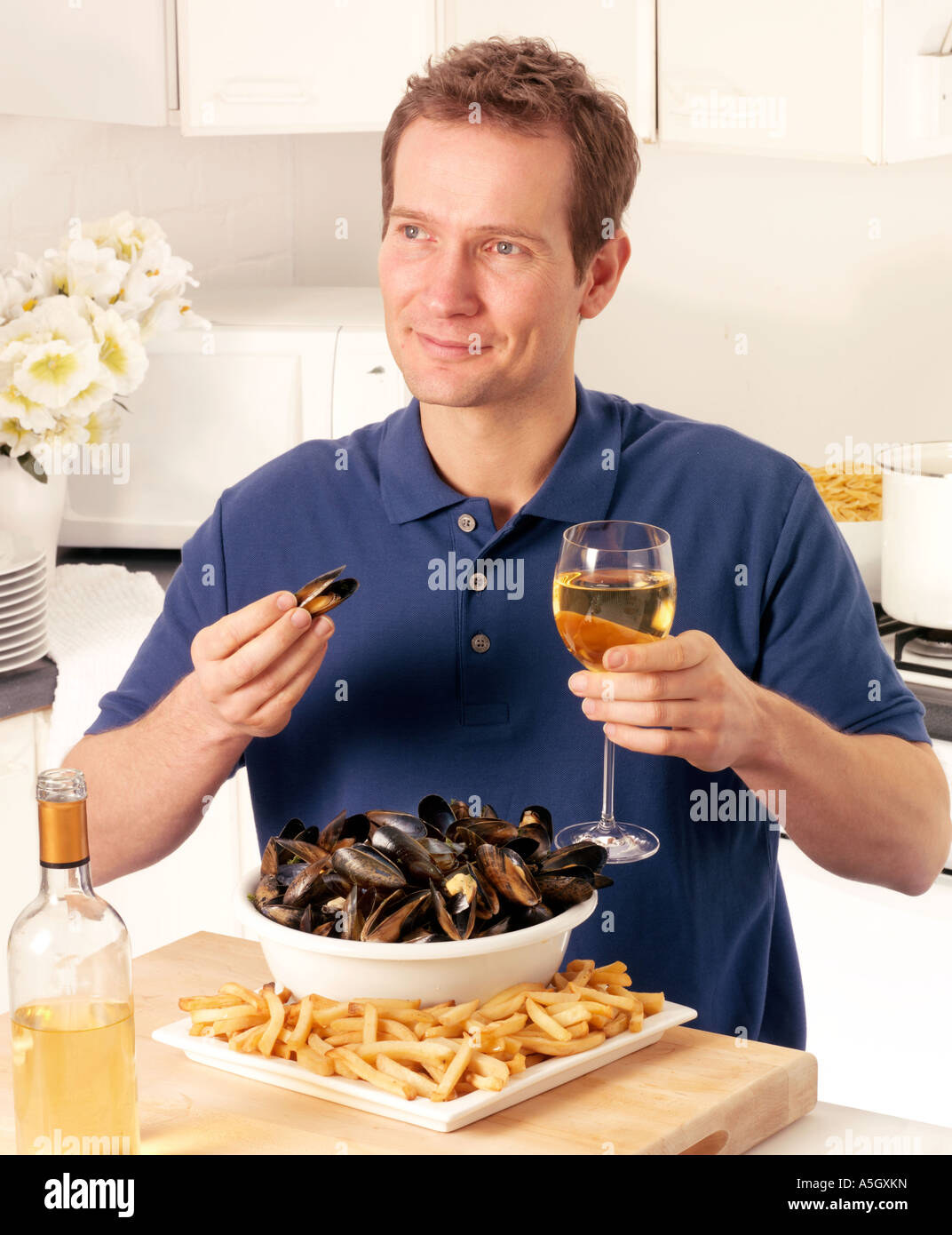 Someone eating fish and chips hi-res stock photography and images - Alamy