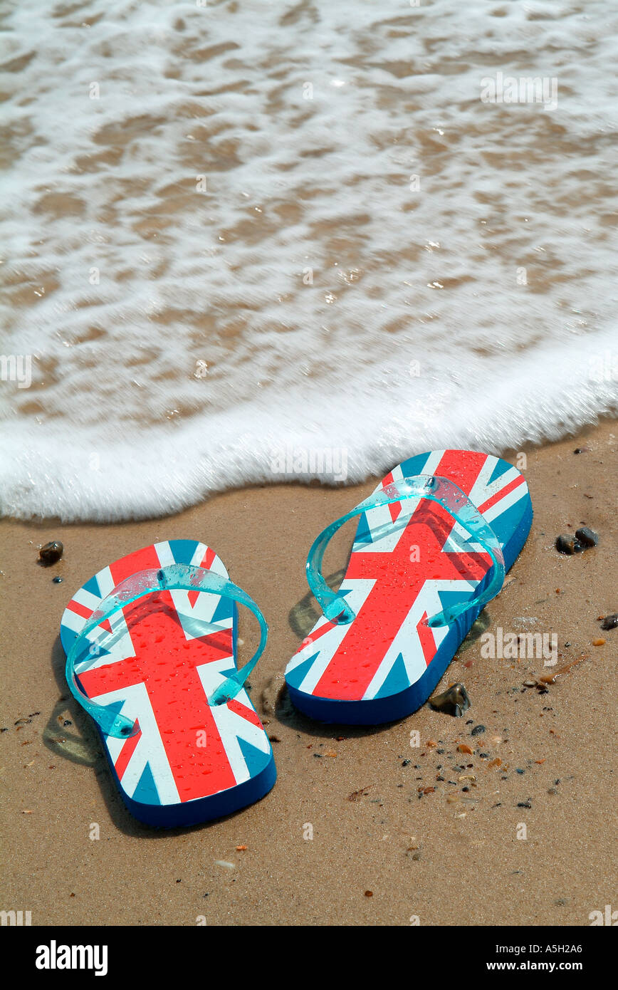 union jack flip flops on beach Stock Photo - Alamy