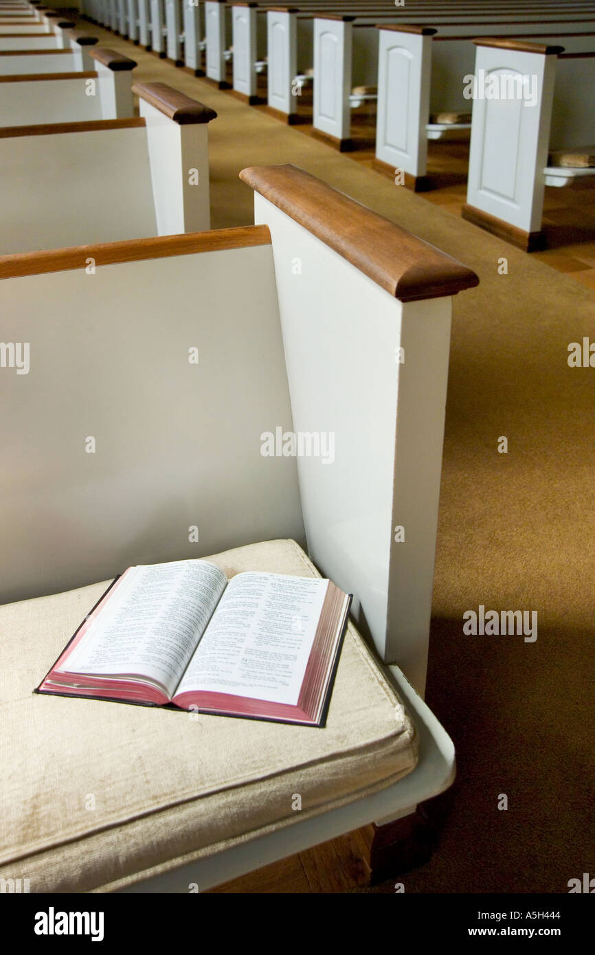 Church interior with Bible on a pew Stock Photo - Alamy