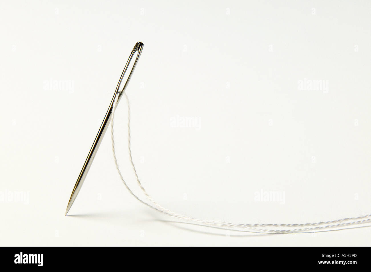 Needle and thread Stock Photo - Alamy