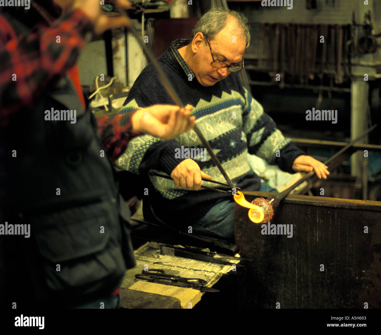 Glass blower at his furnace in Murano glass works Venice Italy Stock ...
