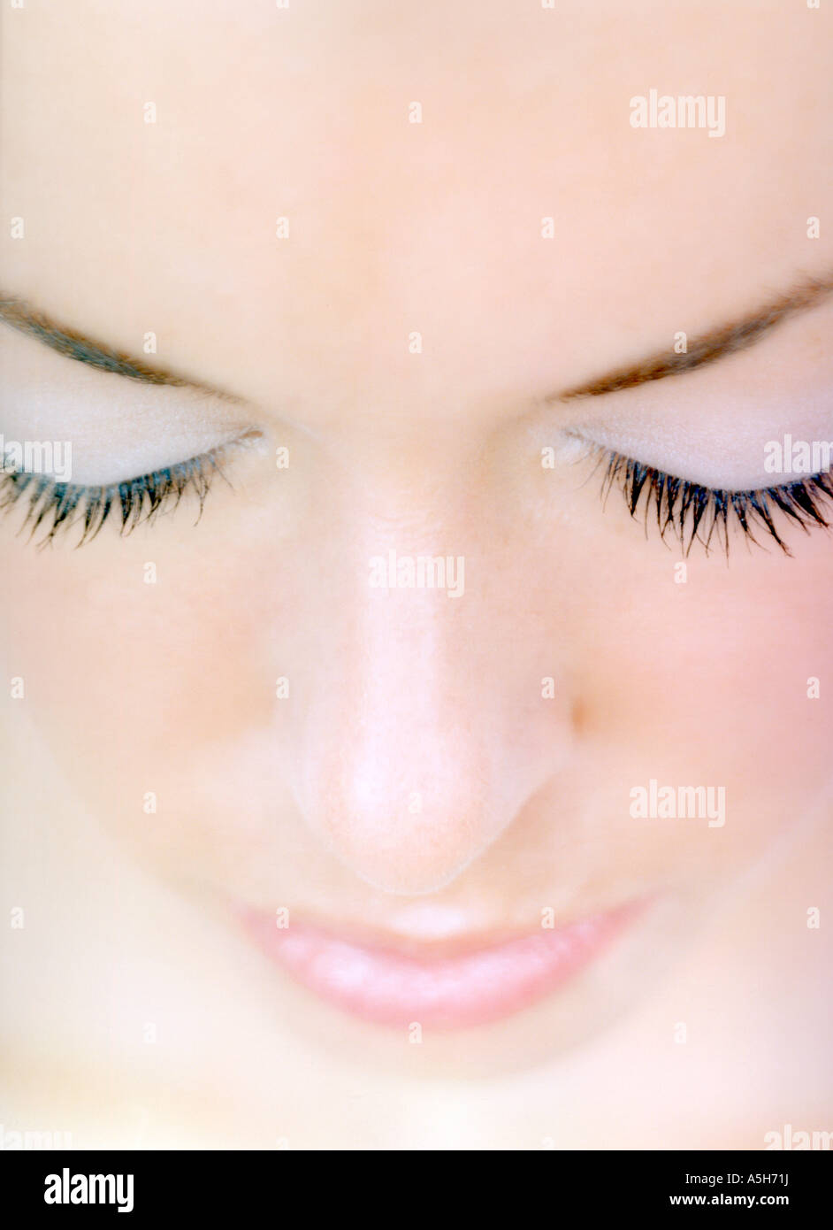 Closeup of a womans face with her eyes closed Stock Photo - Alamy