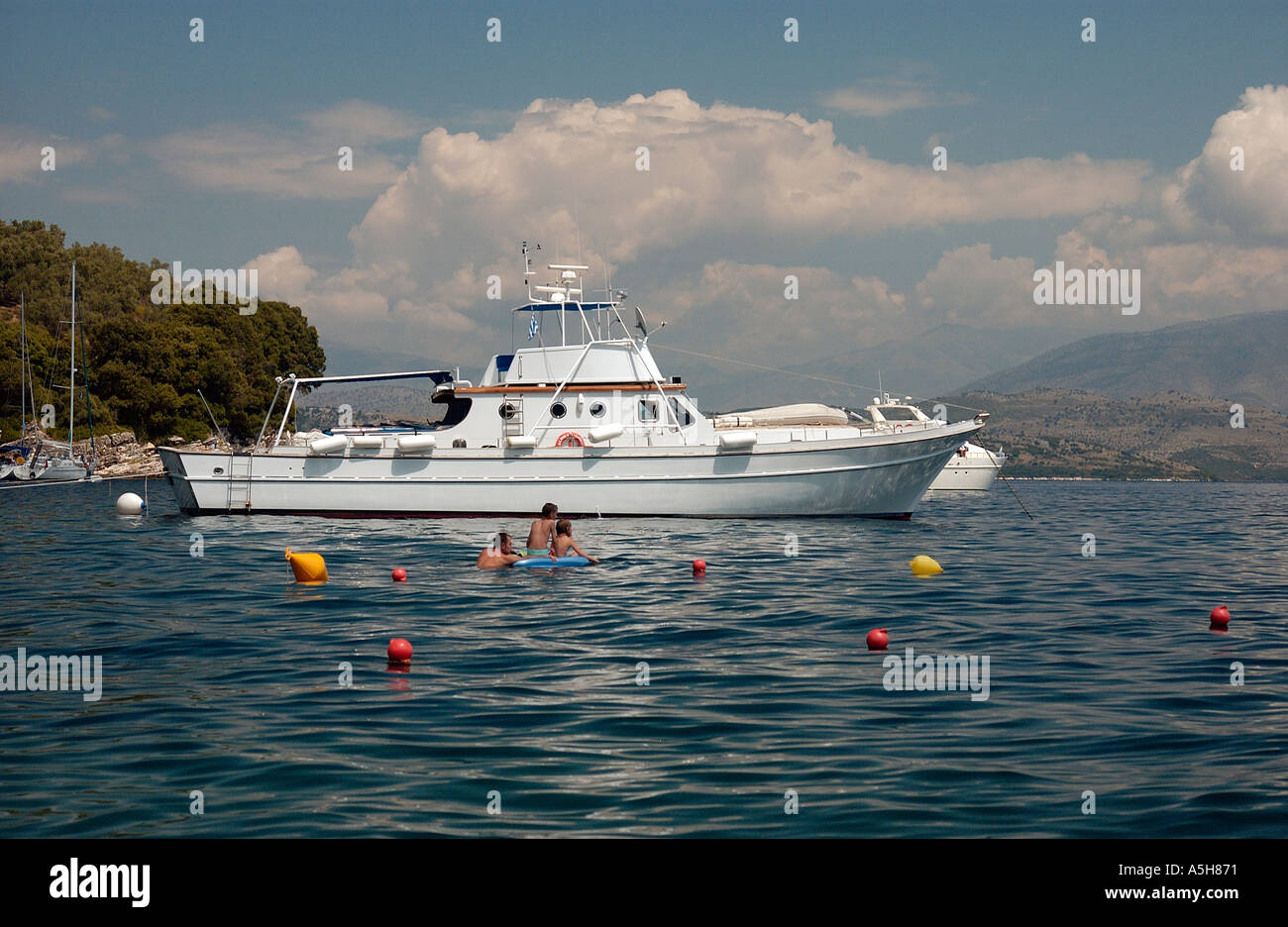 Corfu boat family hi-res stock photography and images - Alamy