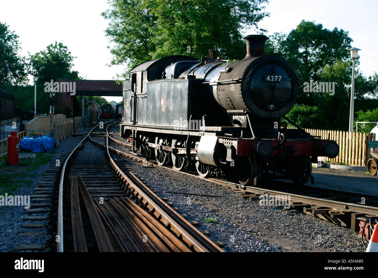 Large steam engine being delivered and unloaded from the back of a ...