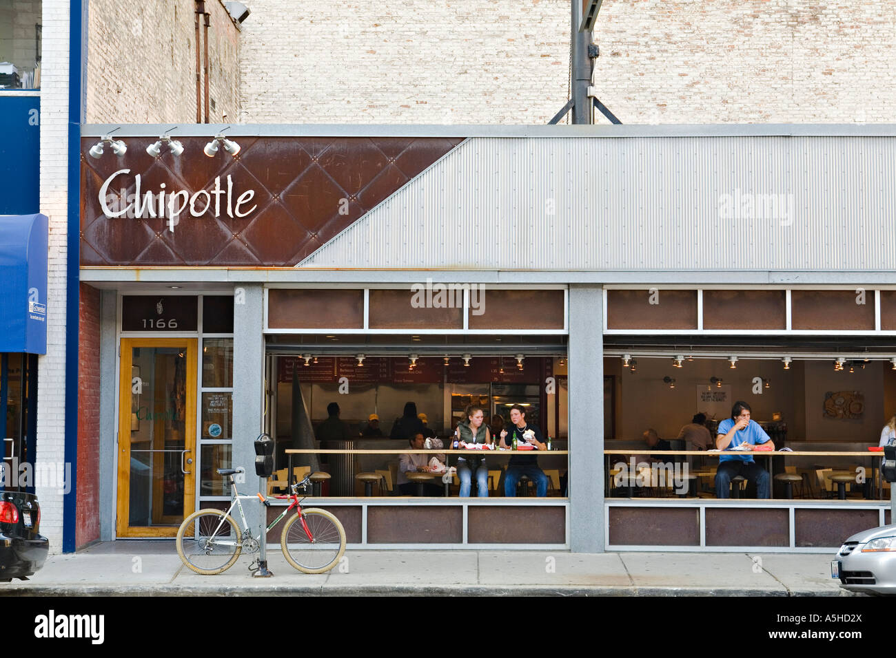 ILLINOIS Chicago People eat along counter at Chipotle restaurant open ...