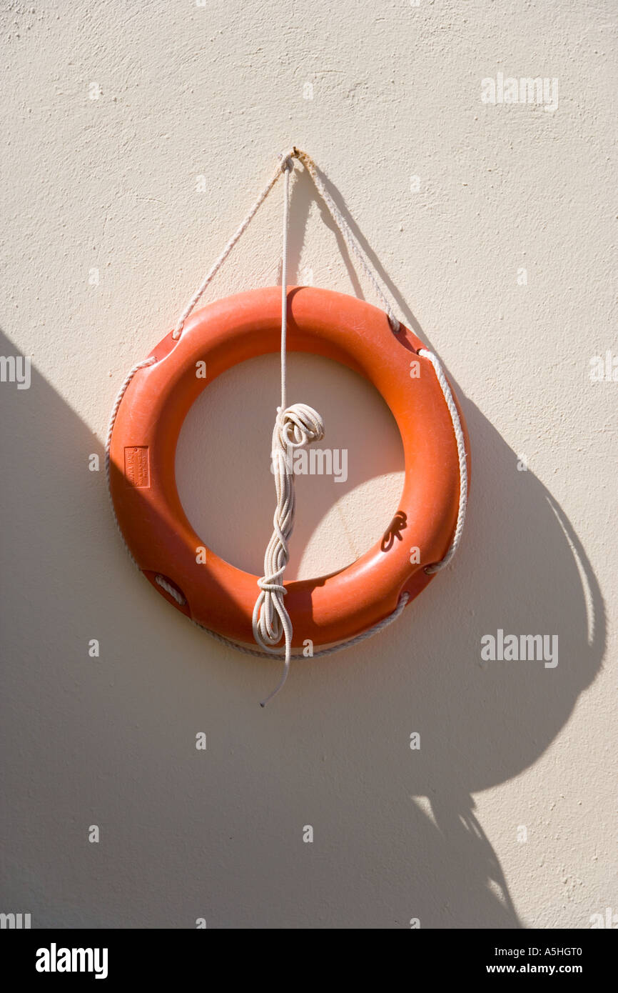 Life Saving Buoy Hanging on a Wall Stock Photo - Alamy