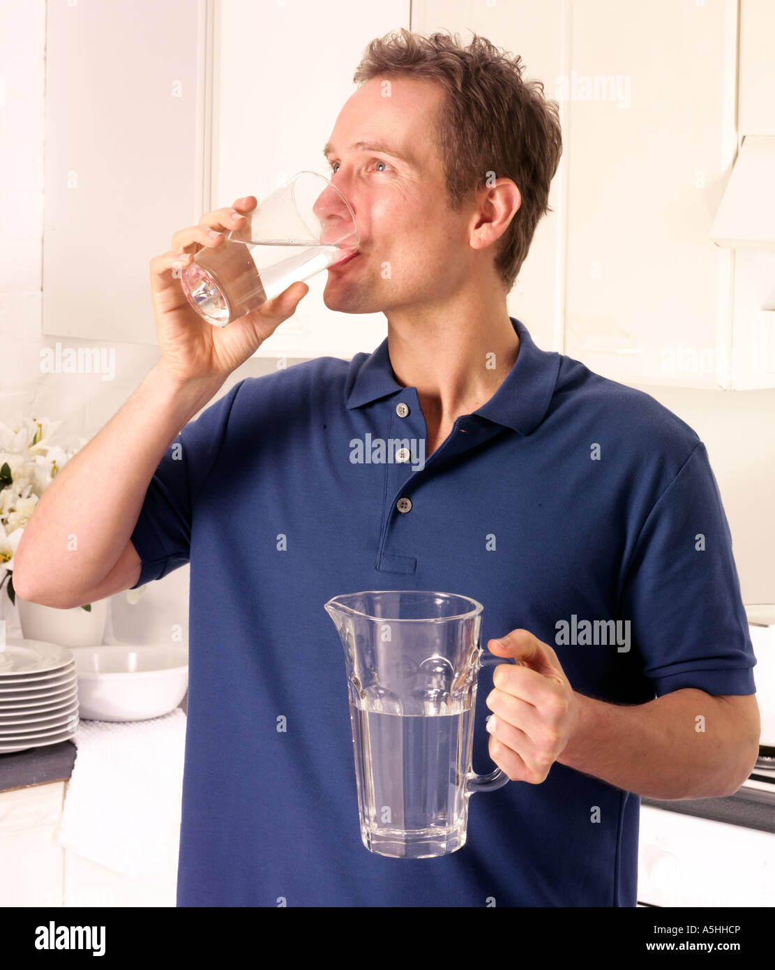 Man male person drink water glass jug hi-res stock photography and ...