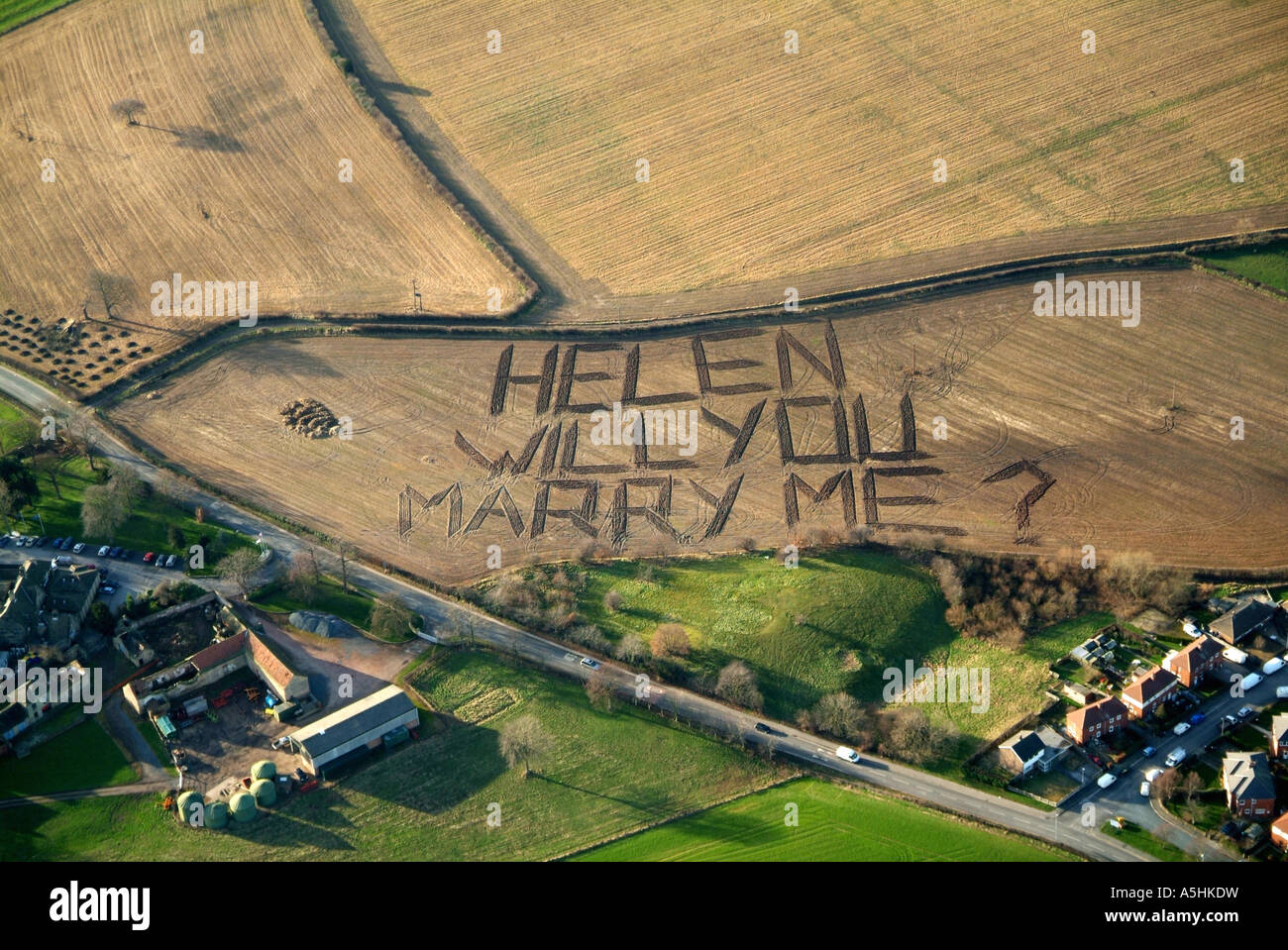 Marriage proposal written in a field, aerial view, northern england ...