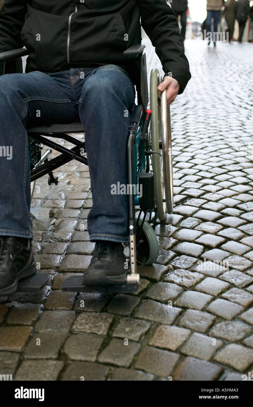 Disabled man in wheelchair Stock Photo - Alamy