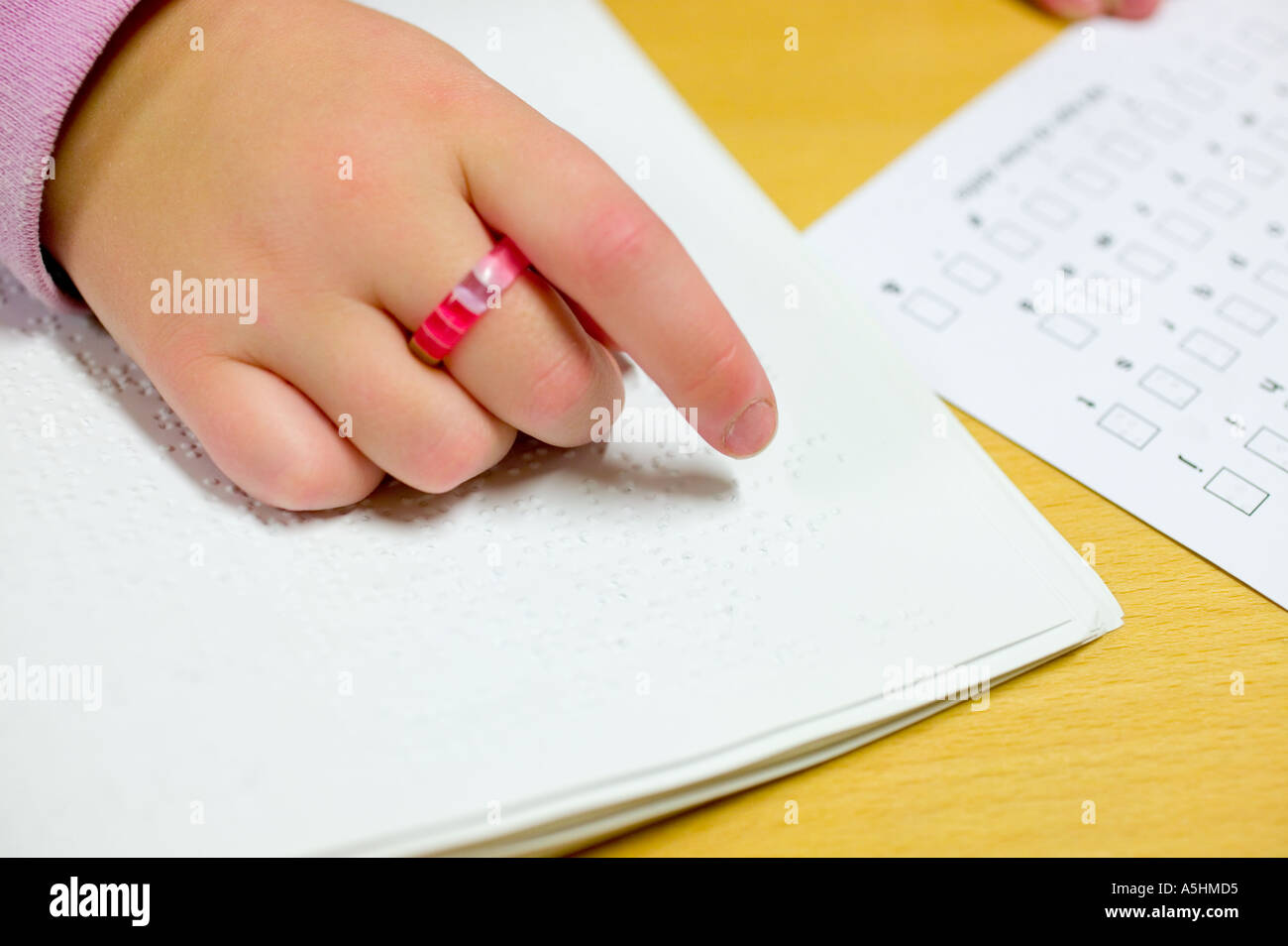 Child reading braille book hi-res stock photography and images - Alamy